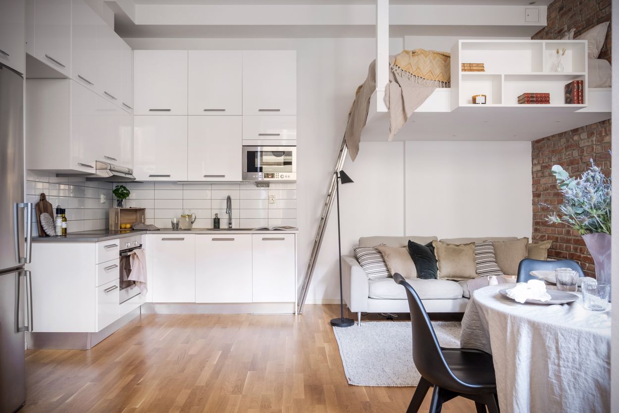 Un studio de 32m2 avec mezzanine au beau mur de briques